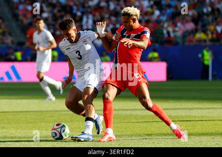 Norway midfielder Antonio Nusa left and Iraq defender Hussein Ali in ...
