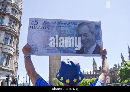 A large mock 5 million pound note with a portrait of Reform UK leader ...