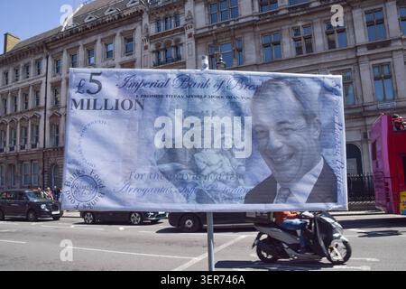 A large mock 5 million pound note with a portrait of Reform UK leader ...