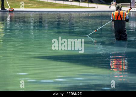 A National Park Service employee uses a vacuum to clean the Lincoln ...
