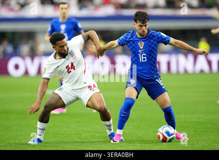 Reece James (England) and Martin Baturina (Croatia) battle for the ball ...
