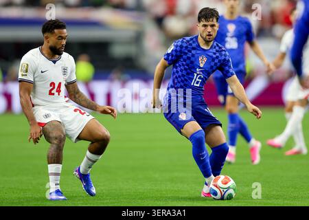 Reece James (England) and Martin Baturina (Croatia) battle for the ball ...