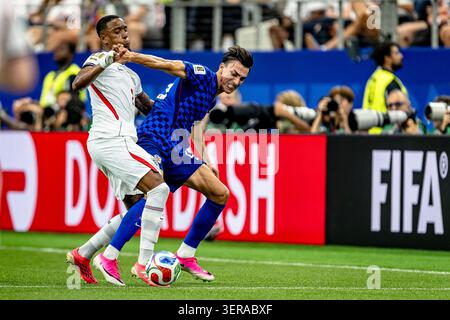 Ezri Konsa of England and Petar Musa of Croatia during the FIFA World ...