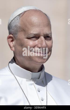 Pope Leo XIV waves as he arrives for his weekly general audience at St ...