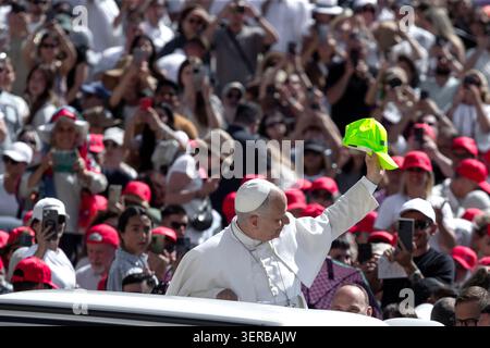 Pope Leo XIV waves as he arrives for his weekly general audience at St ...