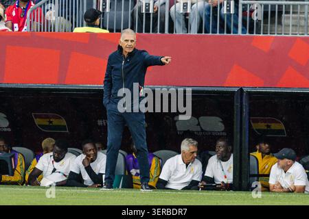 Ghana head coach Carlos Queiroz speaks with his players during a ...