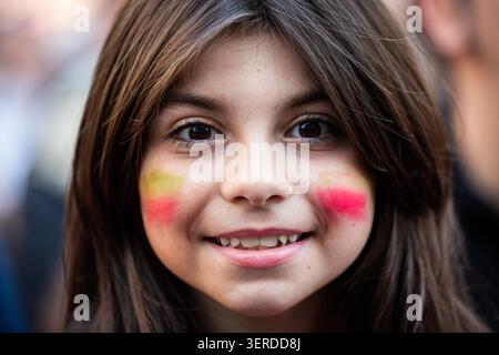 A supporter with face paint reacts while watching the Portugal vs DR ...