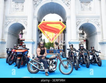 Jason Momoa (centre) during a photocall for Supergirl at Marble Arch in ...