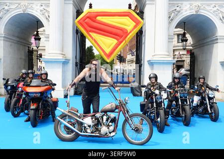 Jason Momoa (centre) during a photocall for Supergirl at Marble Arch in ...