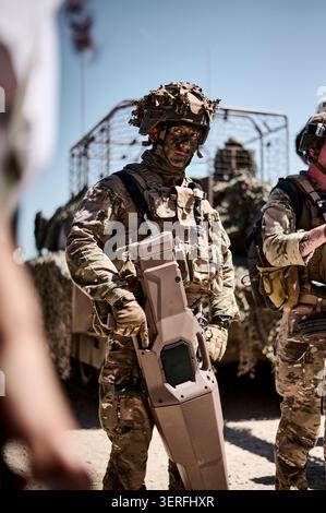A soldier equipped with a drone-jamming rifle after a demonstration, at ...