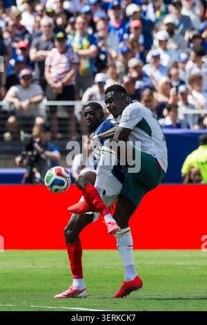 Moussa Niakhate of Senegal competes for the ball with Alexander Sorloth ...