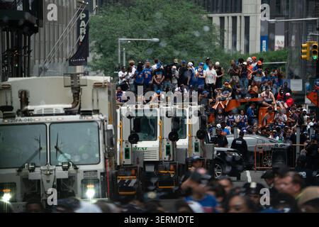 Fans sit atop salt trucks to watch the 2026 NBA Championship parade for ...