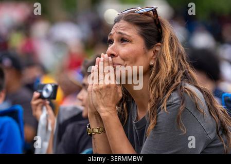 A woman cries during the former President Barack Obama's speech at ...