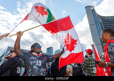 Toronto, Canada. 18 June, 2026. Fans celebrate at Nathan Phillips ...