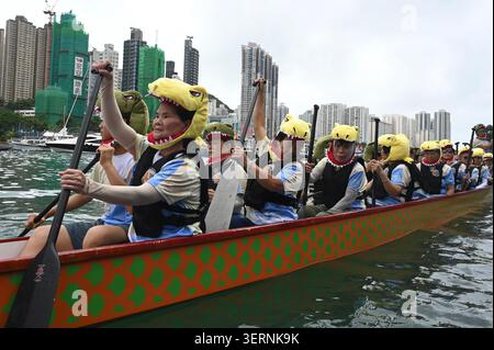 Cosplayers cosplaying Dinosaur on a dragon boat race in Aberdeen ...