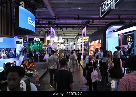 This photograph shows the VivaTech event as visitors walk around in ...