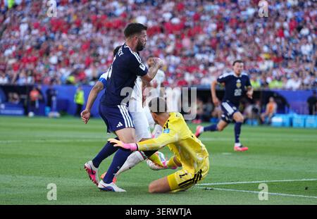 Grant Hanley (Scotland) and Achraf Hakimi (Morocco) battle for the ball ...
