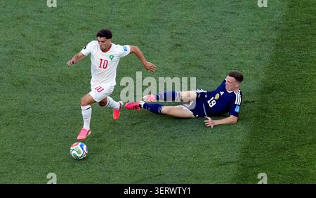 Brahim Diaz (Morocco) and Lewis Ferguson (Scotland) battle for the ball ...