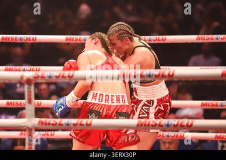 Mexican boxer María del Sol Moreno punches Canadian boxer Marie-Pier ...