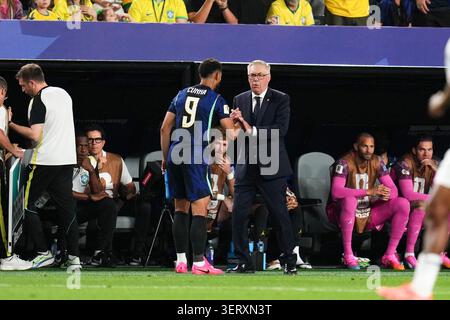 Matheus Cunha of Brazil shakes hands with Carlo Ancelotti, head coach ...