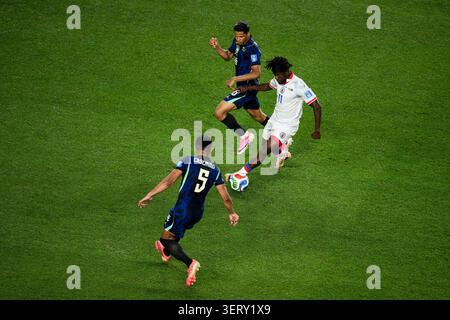 Louicius Deedson of Haiti is challenged by Douglas Santos of Brazil ...
