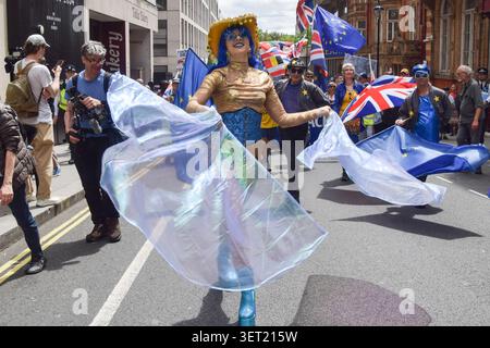London, UK, 20th June 2026. Protesters pass across Westminster Bridge ...