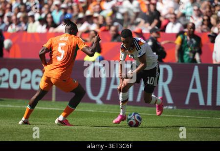 Wilfried Singo (Ivory Coast) and Jamal Musiala (Germany) battle for the ...