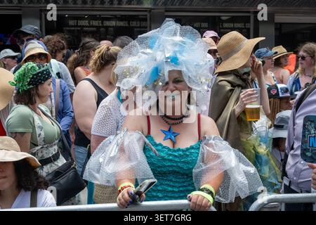 An onlooker reacts during the annual Mermaid Parade at Coney Island on ...