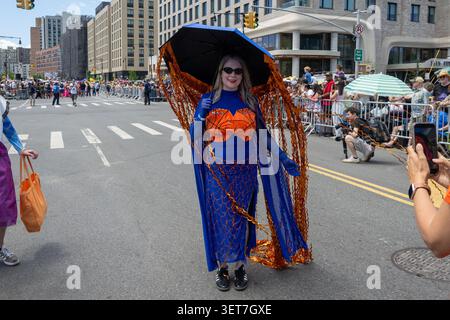 A reveler with their face painted participates in the annual Mermaid ...