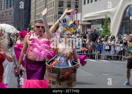 A reveler dress as a lobster meal participates in the annual Mermaid ...