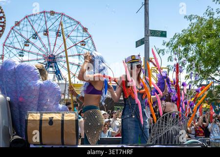 Revelers participate in the annual Mermaid Parade on Surf Ave at Coney ...