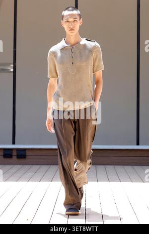 MILAN, ITALY - JUNE 21, 2026: Yu Chengen leaves the Prada fashion show ...