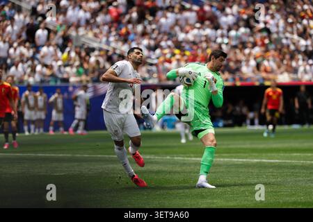 Belgium goalkeeper Thibaut Courtois (1) and IR Iran' Mehdi Taremi (9 ...