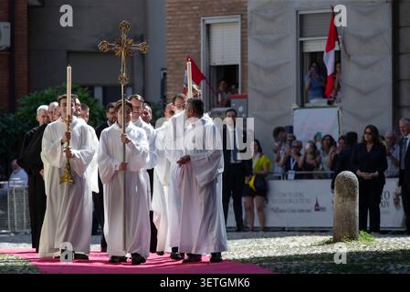 Priests await the start of the procession with Pope Leo XIV at the ...
