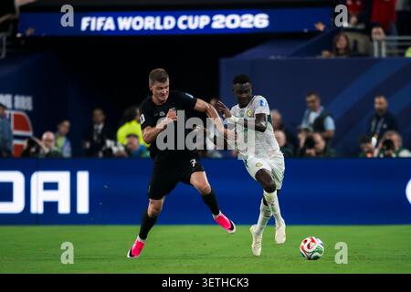 Moussa Niakhate of Senegal competes for the ball with Alexander Sorloth ...