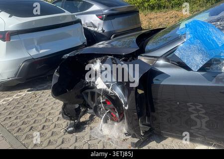 Accident damage to a TESLA electric car, damage to the front part ...