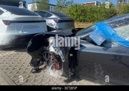 Accident damage to a TESLA electric car, damage to the front part ...