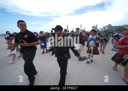 Police officers patrol as the Tartan Army march in Miami ahead of their ...