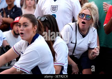 Fans watch a screening of the FIFA World Cup match between England and ...
