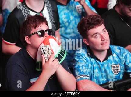 Fans watch a screening of the FIFA World Cup match between England and ...