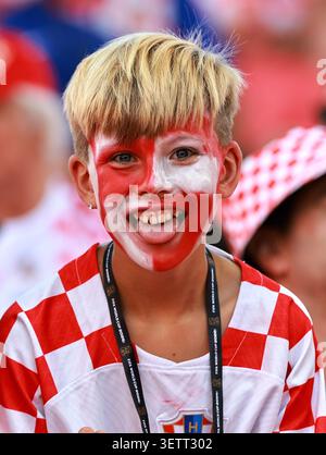 A fan reacts before the World Cup Group K soccer match between Colombia ...