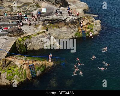 People cooling off at the Forty Foot bathing place at Sandycove in ...