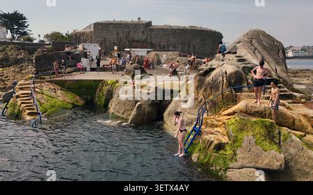 People cooling off at the Forty Foot bathing place at Sandycove in ...