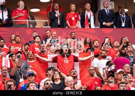 Prime Minister Mark Carney sings along side attendees at the Canada Day ...