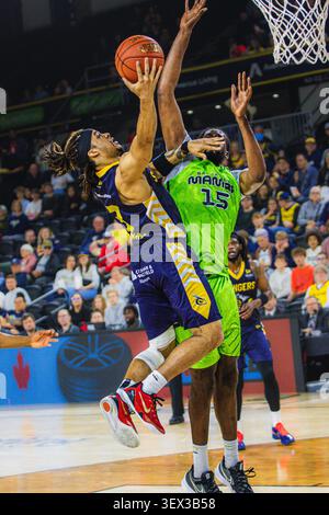 Edmonton Stinger Taye Donald attempts a lay up around Saskatchewan ...