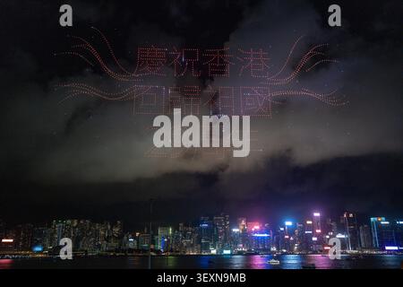 People watching a drone show to mark 29 years after the handover of ...