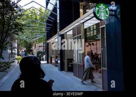 The green Starbucks siren logo is displayed at the chain’s first ...