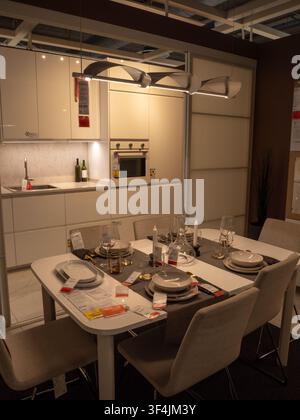 Dining room with glass display cabinets framing open balcony doors ...