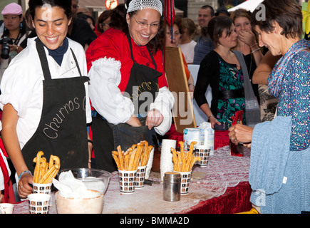 Portrait of Spanish churro vendors at a stall in London, England, UK ...