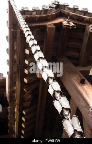 A Japanese rain chain or kusari-doi which is a traditional rain Stock ...